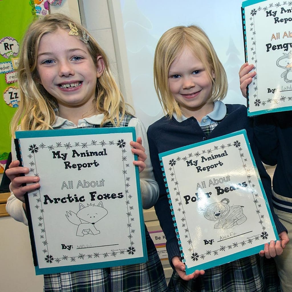 Proud first-graders show off their report books from the class Arctic ...